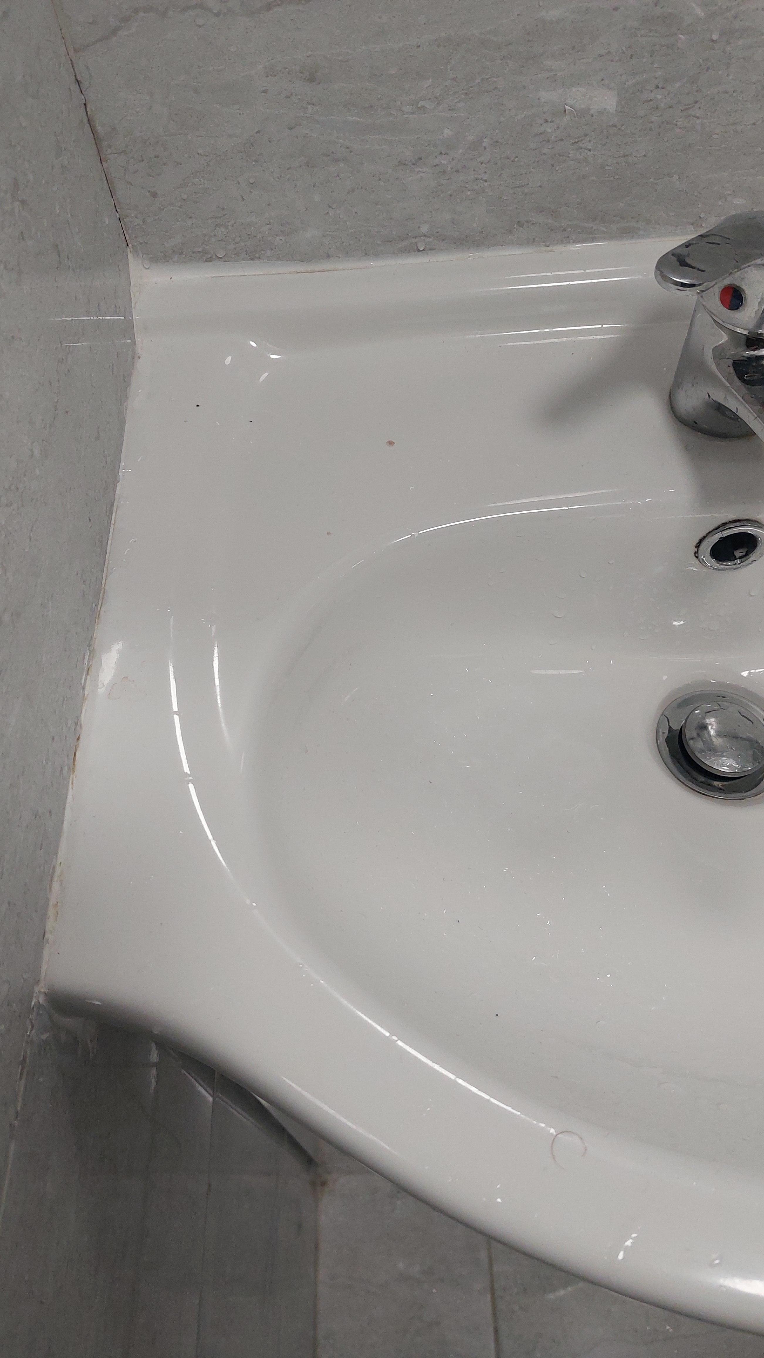 stains (blood?) and hair in sink. Sink also explosively and intermittently spat hot water 