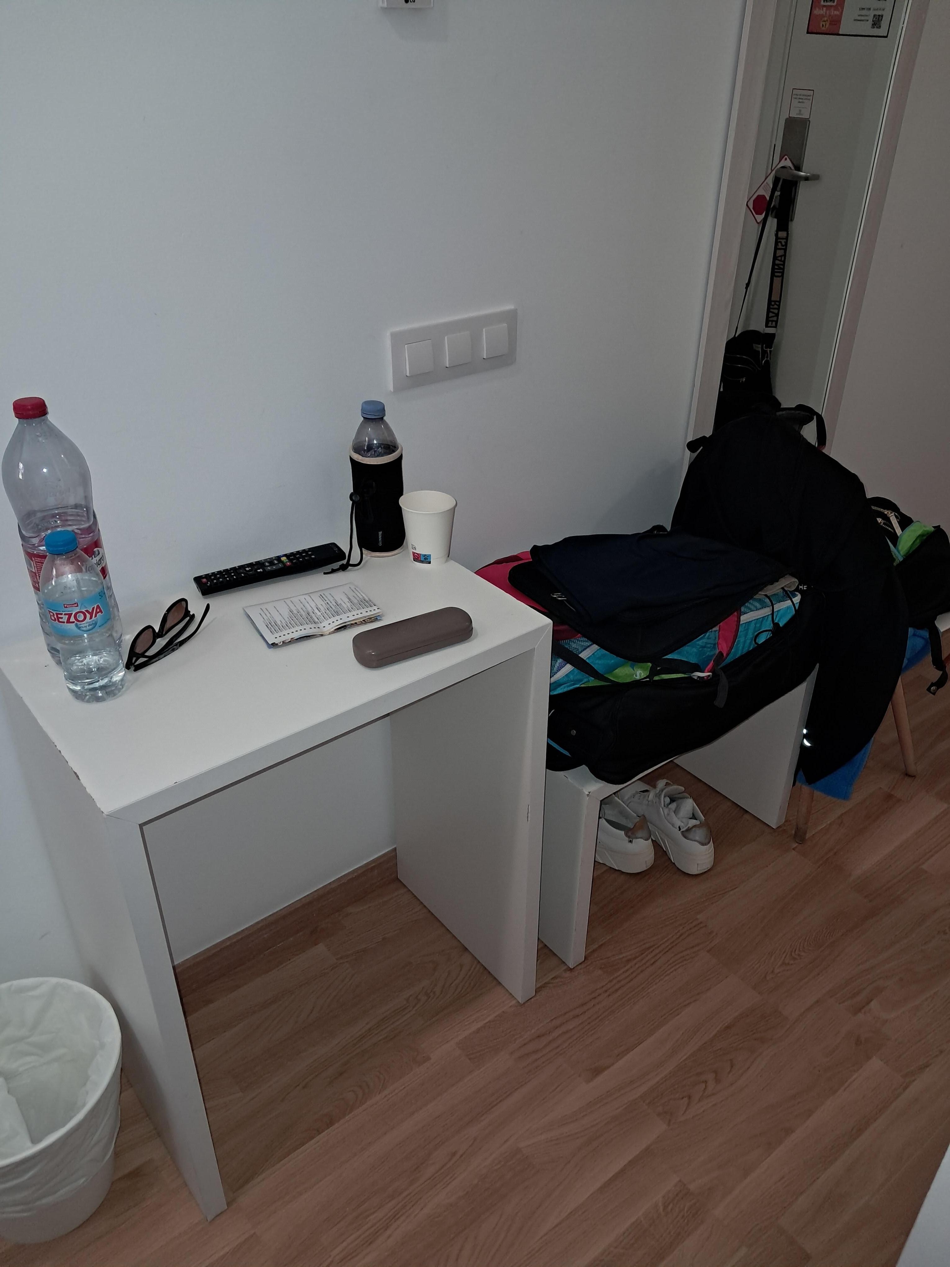 Small desk was ultimately used to set a suitcase on