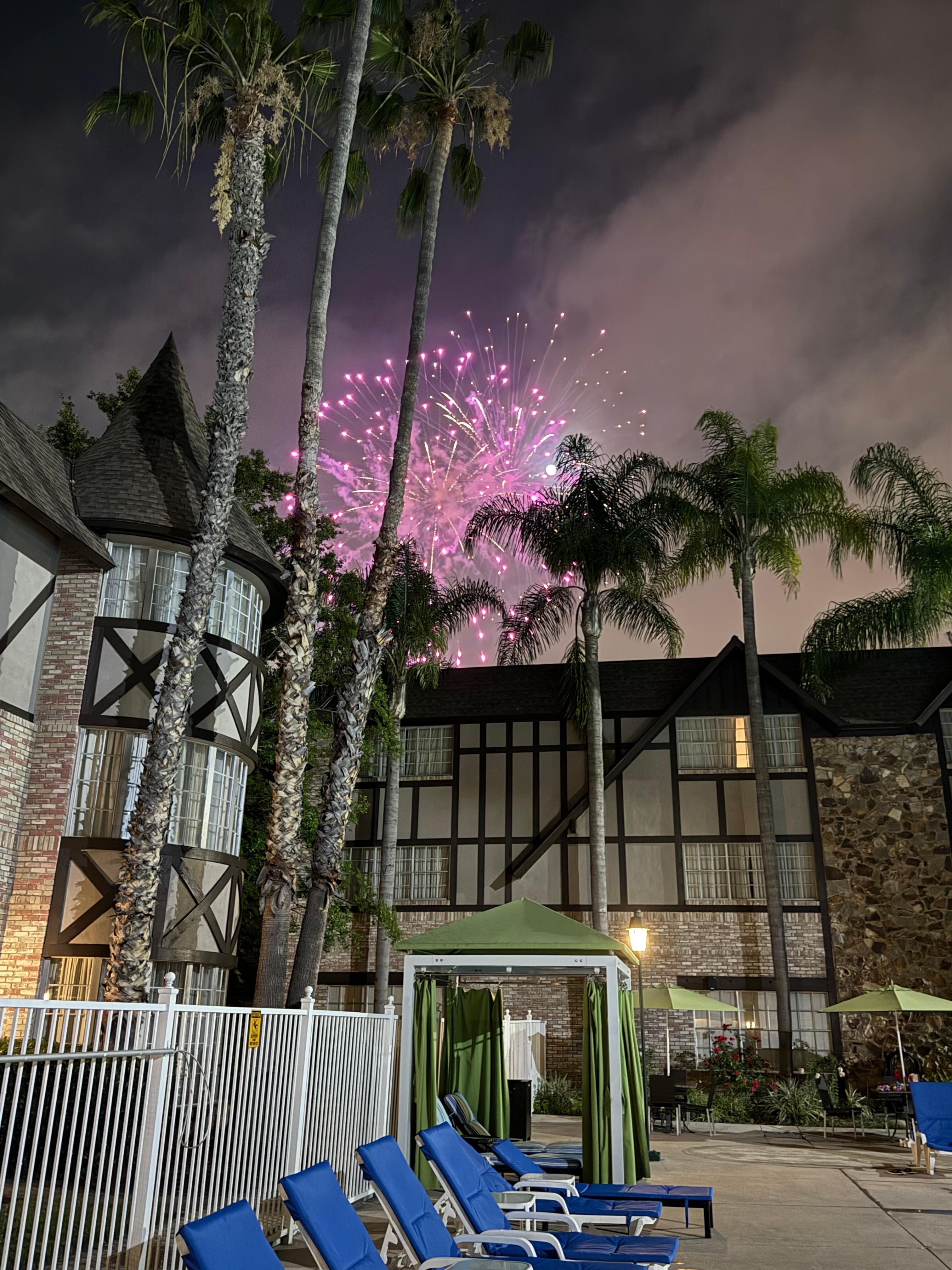 Fire works from
Disneyland seen from the pool. 
