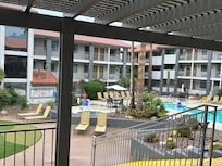 Pool and hot tub with lounge chairs