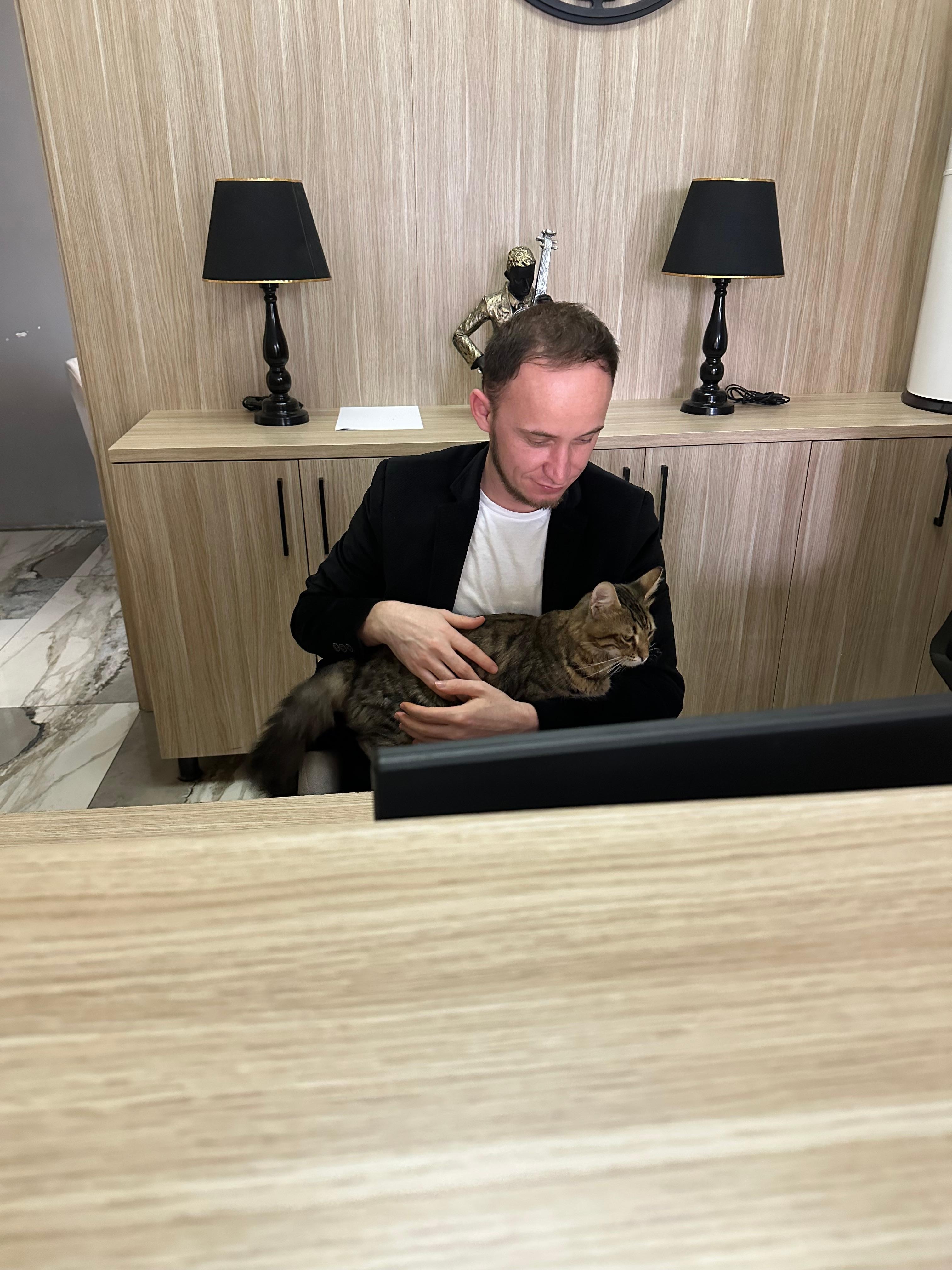 Receptionist with calm cat