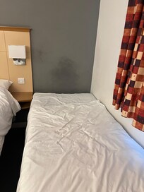 twin beds adjacent to main bed had sweat and crime at head of bed