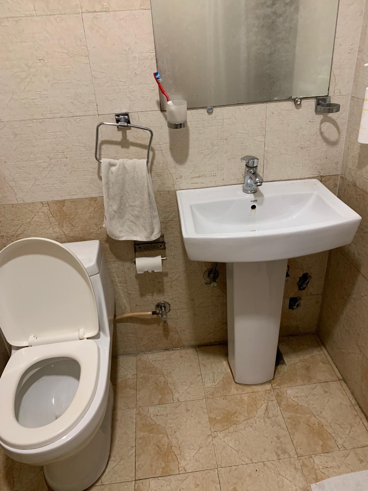 Bathroom, no shelves, slow ti get hot water
Tiny space