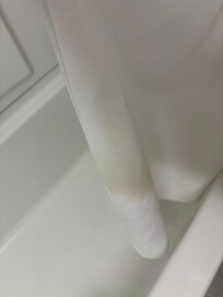Stained shower curtain
