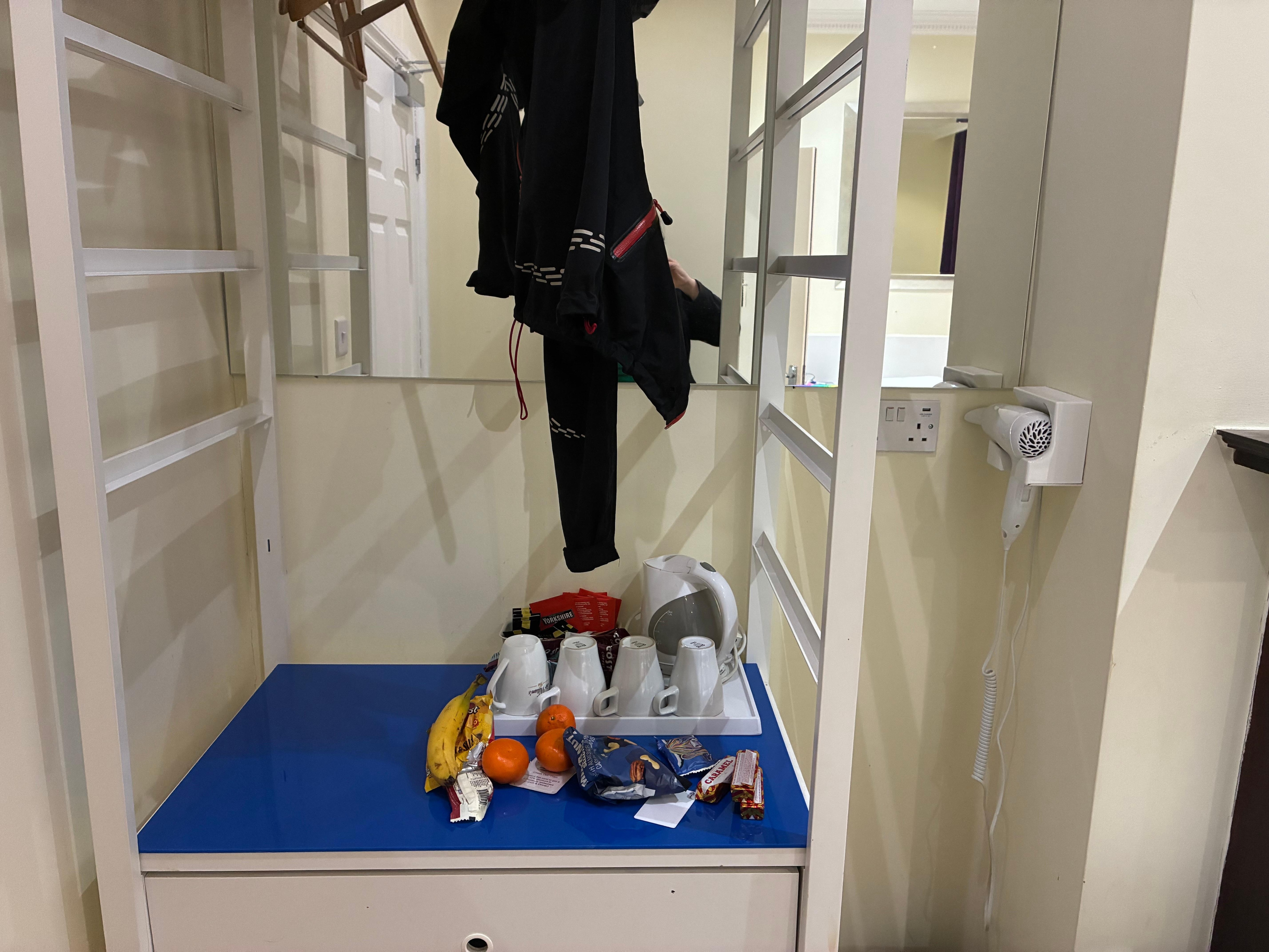 On left as walked in furniture that was only hanging space, drawers, coffee making (fruit and snacks ours) 