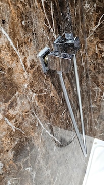 Part of shower hanging off