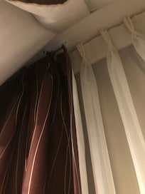 The rails they installed for the drapes do not allow you to close them